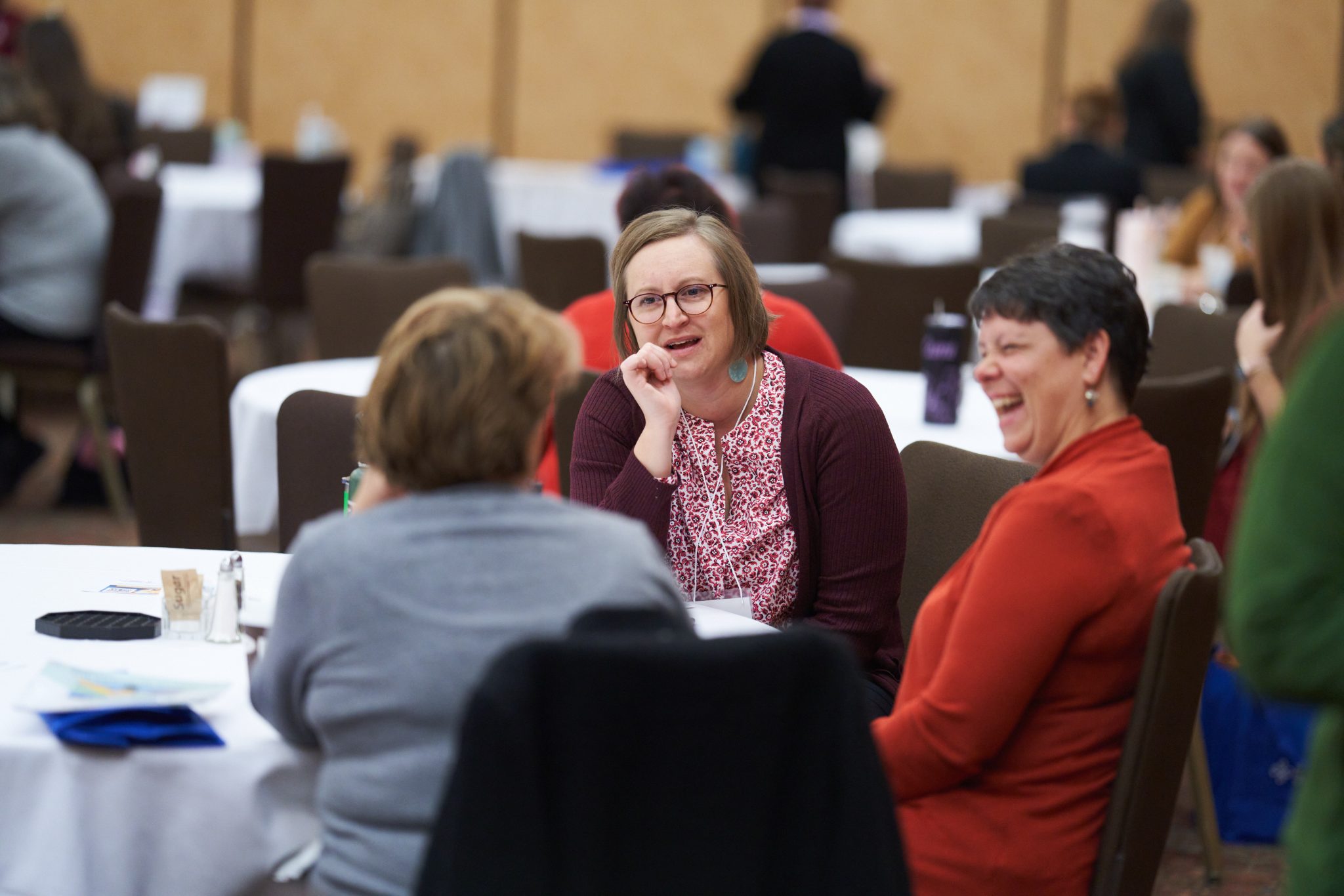 TableShot-AttendeesLaughing | Wisconsin Cancer Collaborative